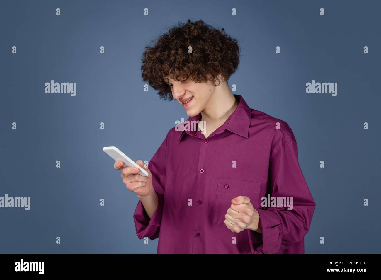 Scrolling screen. Caucasian young handsome man's portrait on blue ...