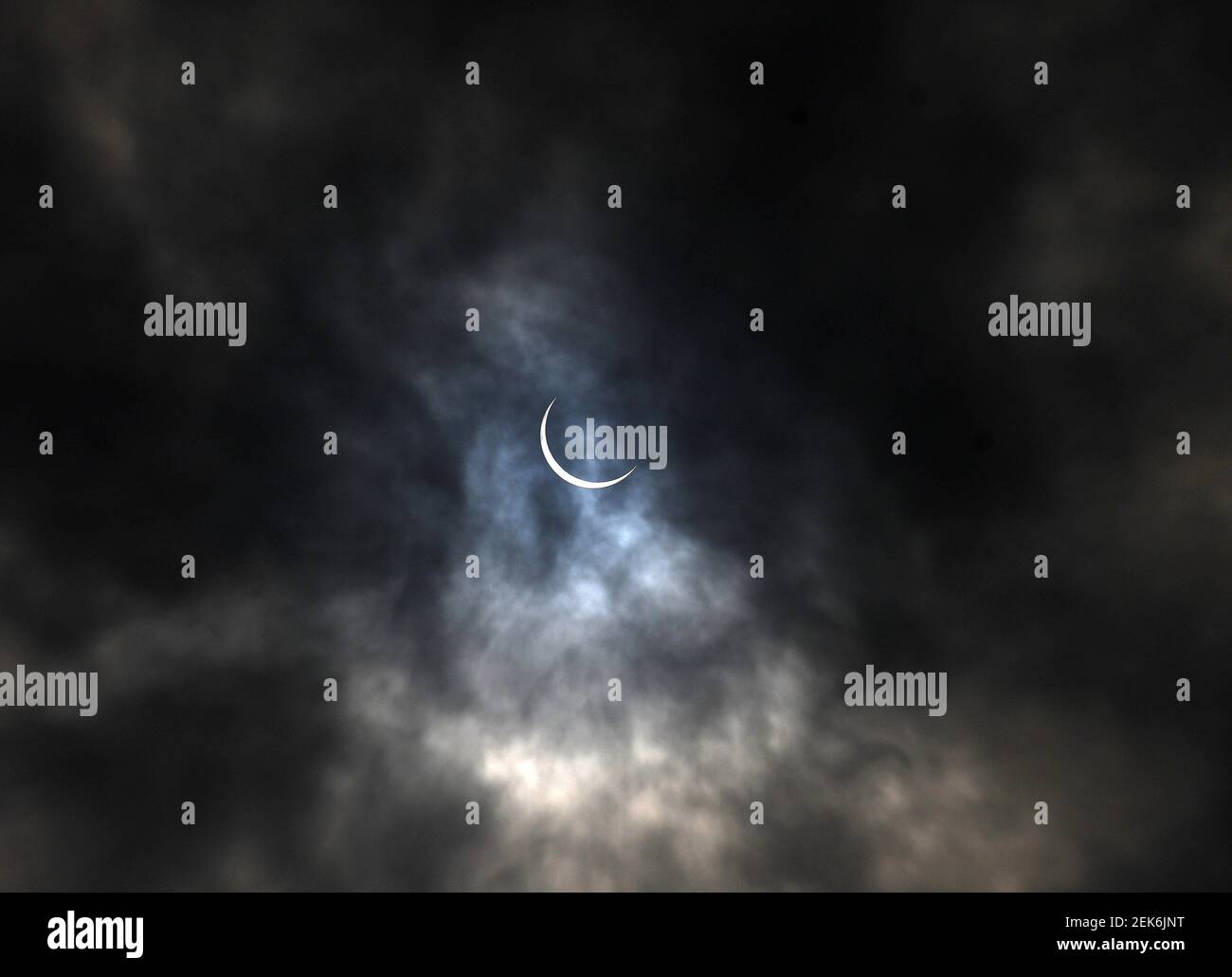 NEW DELHI, INDIA – JUNE 21: A view of the partially eclipsed sun seen ...