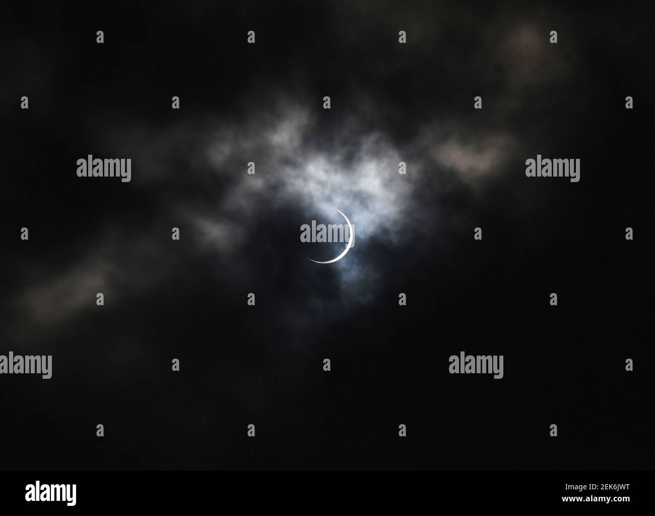 NEW DELHI, INDIA – JUNE 21: A view of the partially eclipsed sun seen ...