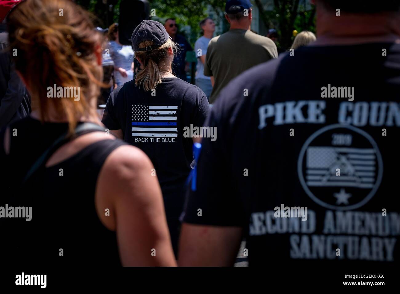 A woman wearing a 'Back the Blue' tee-shirt during a pro-police rally ...