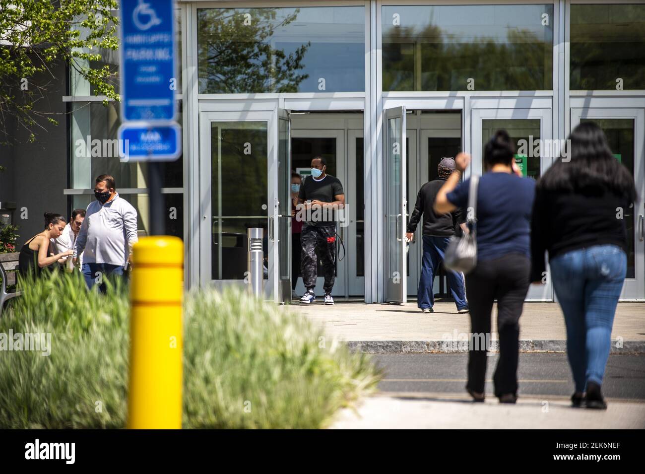 Patrons wear masks as they enter and leave Westfarms mall when the ...