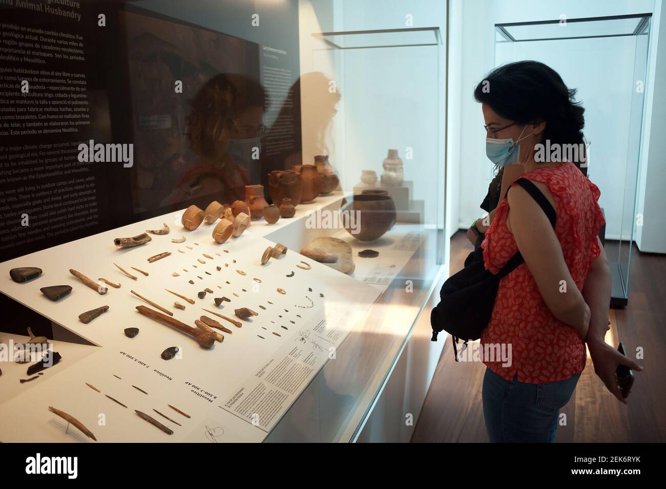 Visitors wearing face masks are seen looking at an archaeological ...