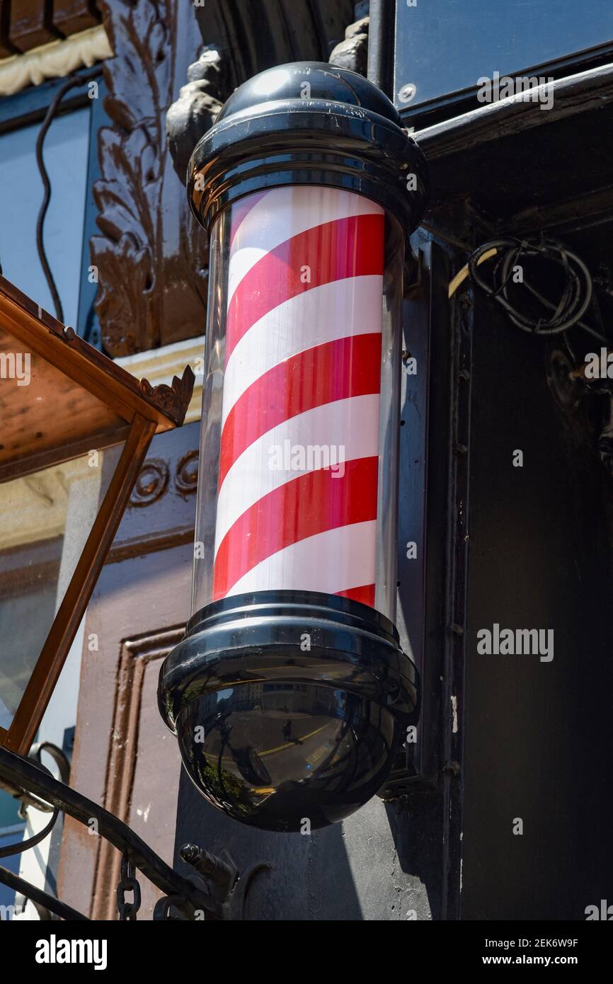 A classic barbers pole outside of a Barbers shop. (Photo by Dave Rushen ...