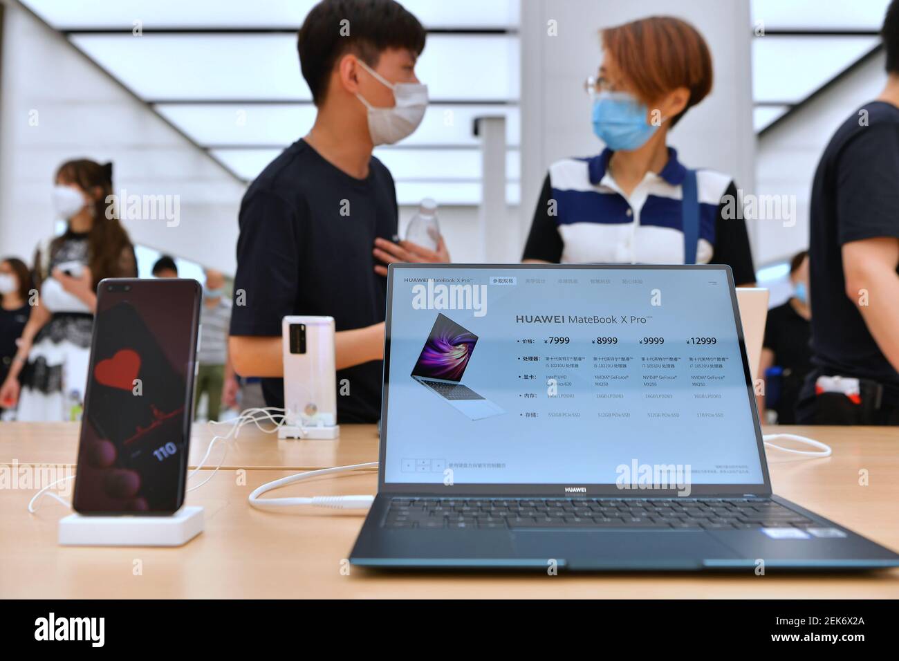 Customers experience Huawei products at the newly opened Huawei ...