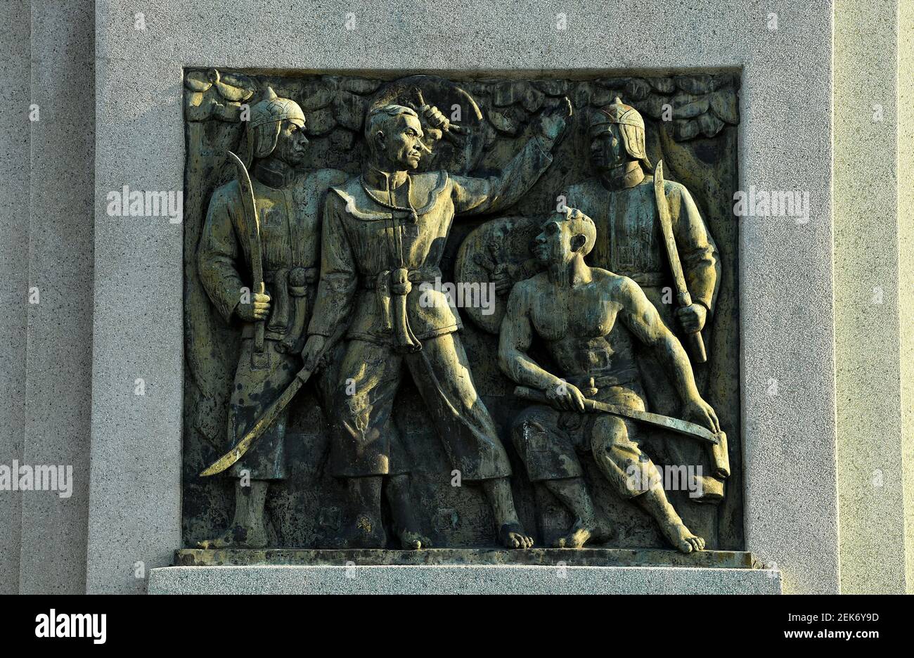 A close up view of a stucco relief at the base of the King Taksin ...