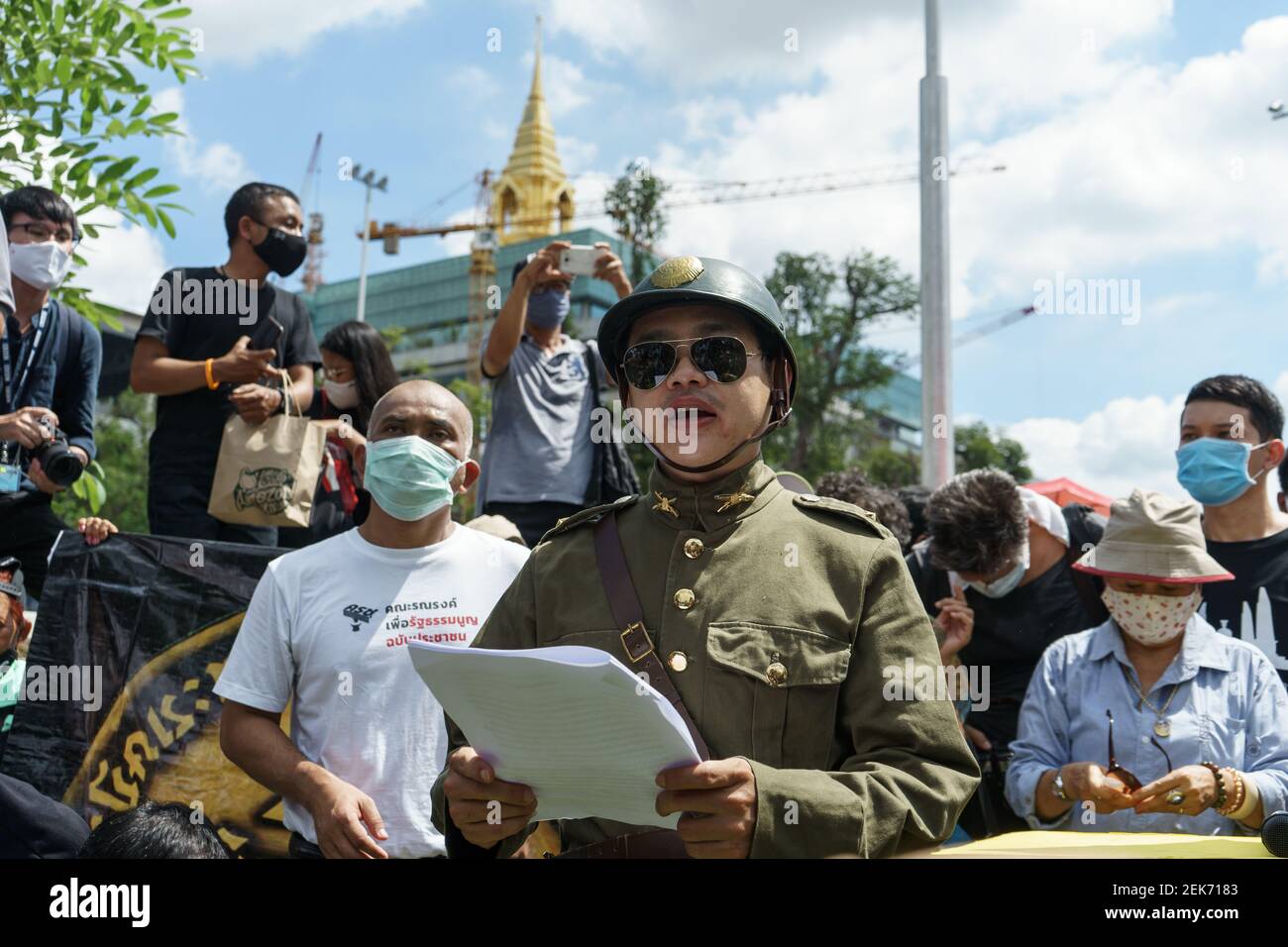 A pro-democracy activist wearing a mask and dressed as a soldier from ...