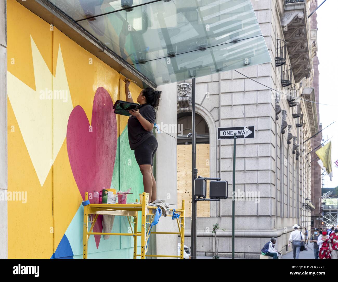 Theresa Rivera design artists paint mural ‘Love NYC’ on windows covered ...