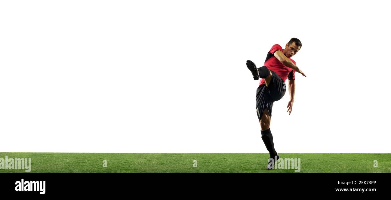 Powerful, flying above the field. Young football, soccer player in ...