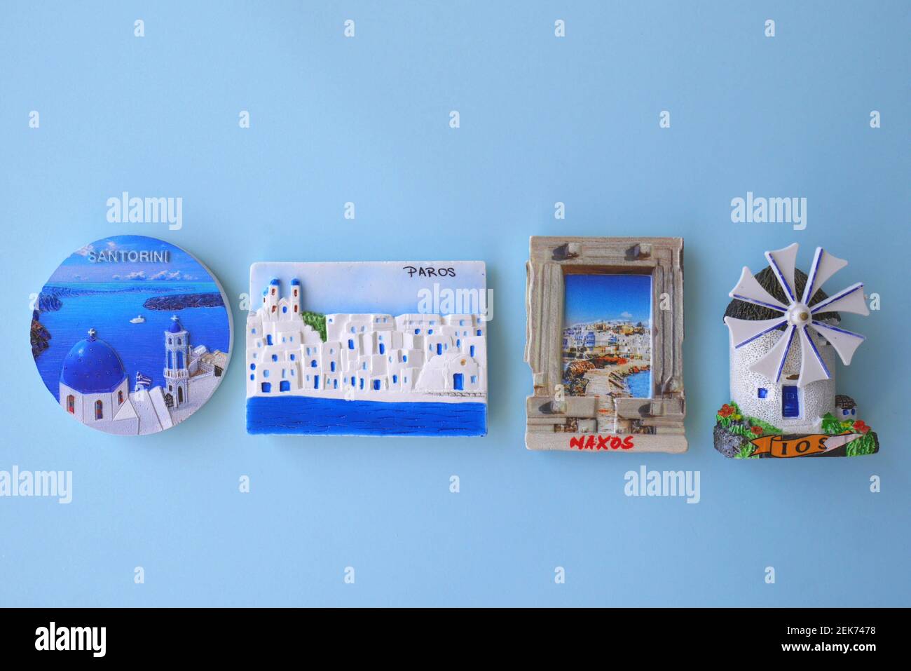 Four fridge magnets representing the Greek islands of Paros, Naxos ...