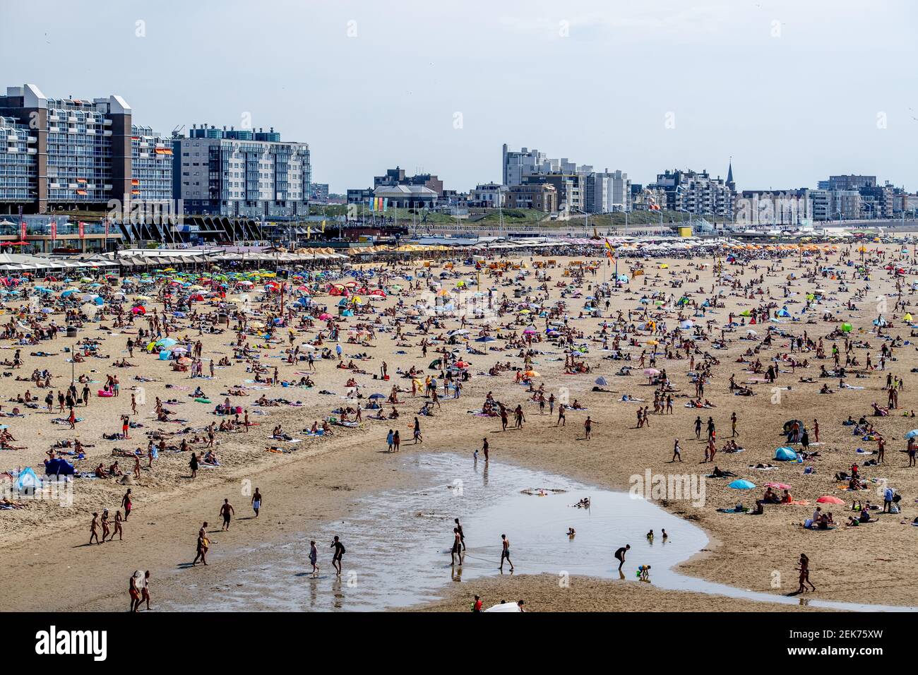 People enjoy the sun and the warm weather during the heat wave at a ...