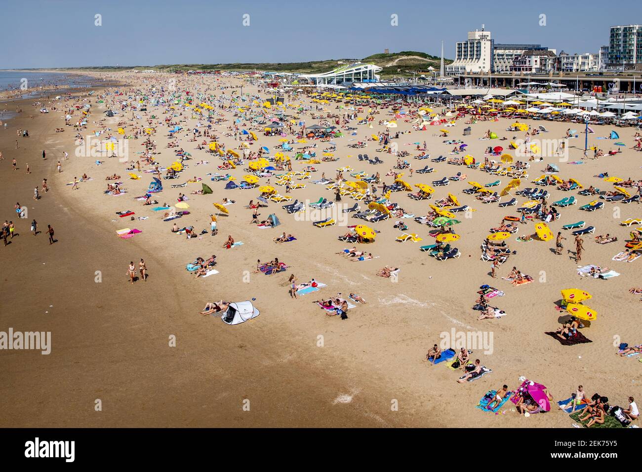 People enjoy the sun and the warm weather during the heat wave at a ...