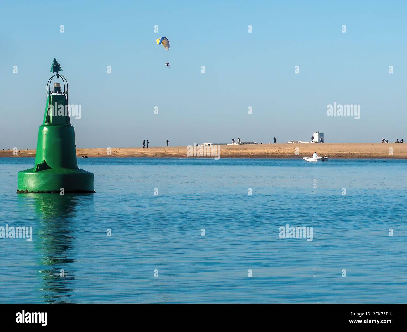 An illuminated buoy or a floating beacon located on the beach of Sancti ...