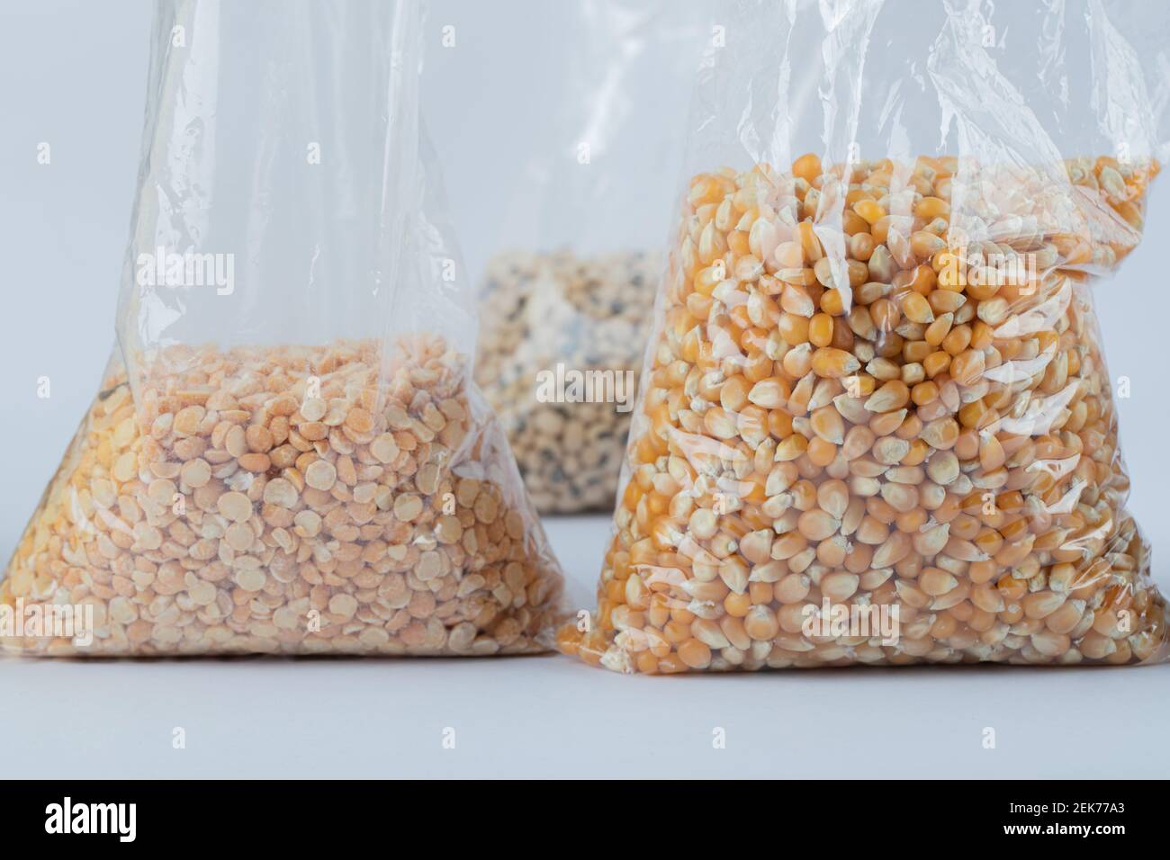 Different kinds of raw beans on a gray background Stock Photo - Alamy