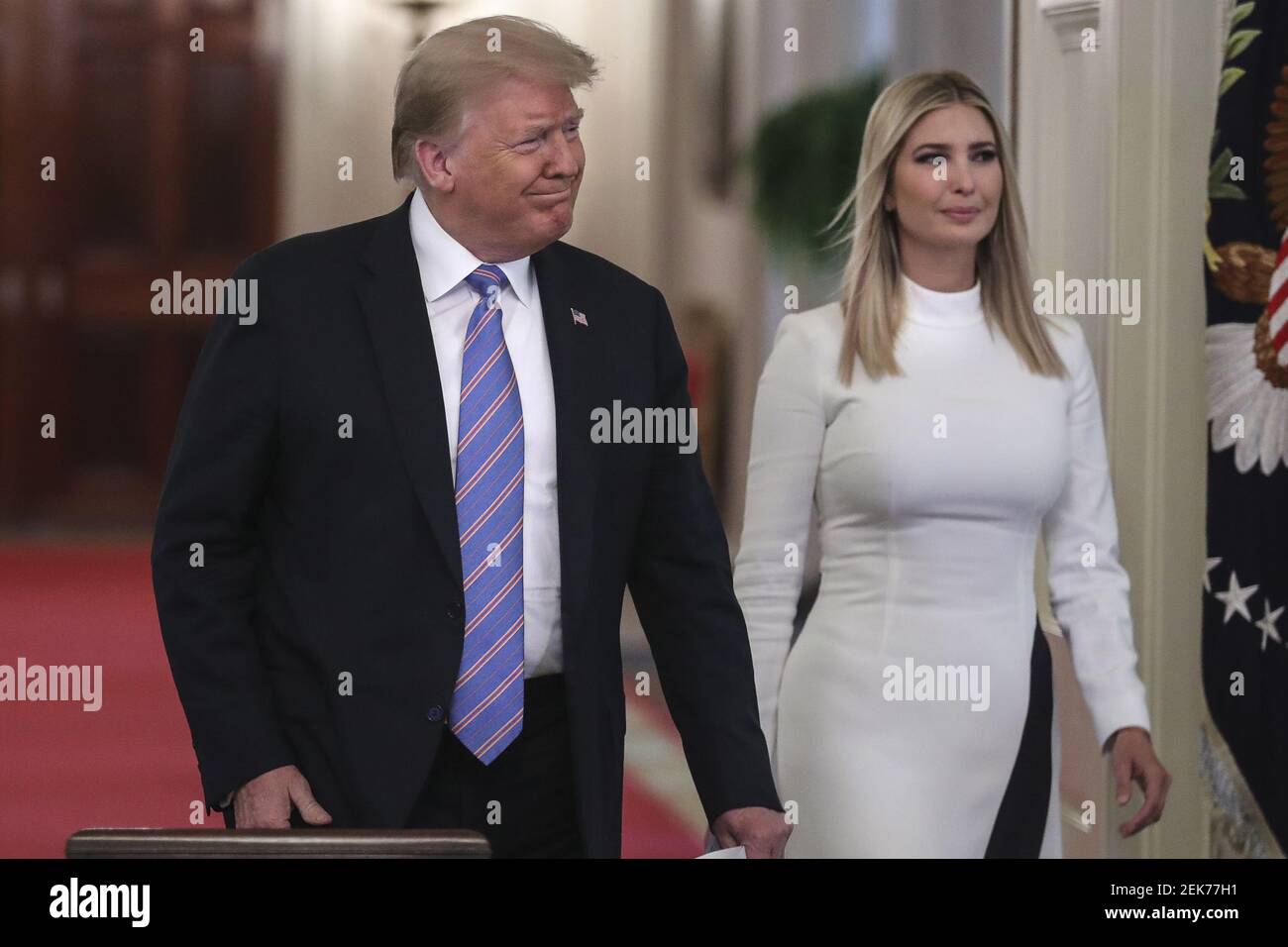 President Donald Trump arrives to the East Room of the White House with ...