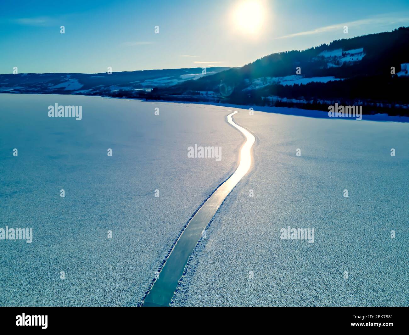 Ice skating road on the clear glassy ice of a large frozen lake Stock ...