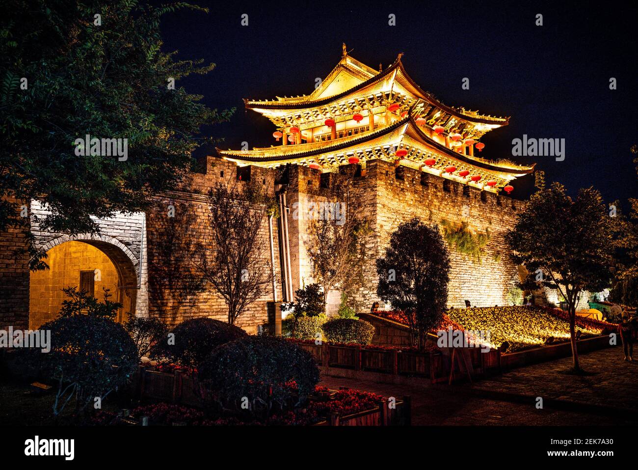 Fortification wall and south gate of Dali old town illuminated at night ...