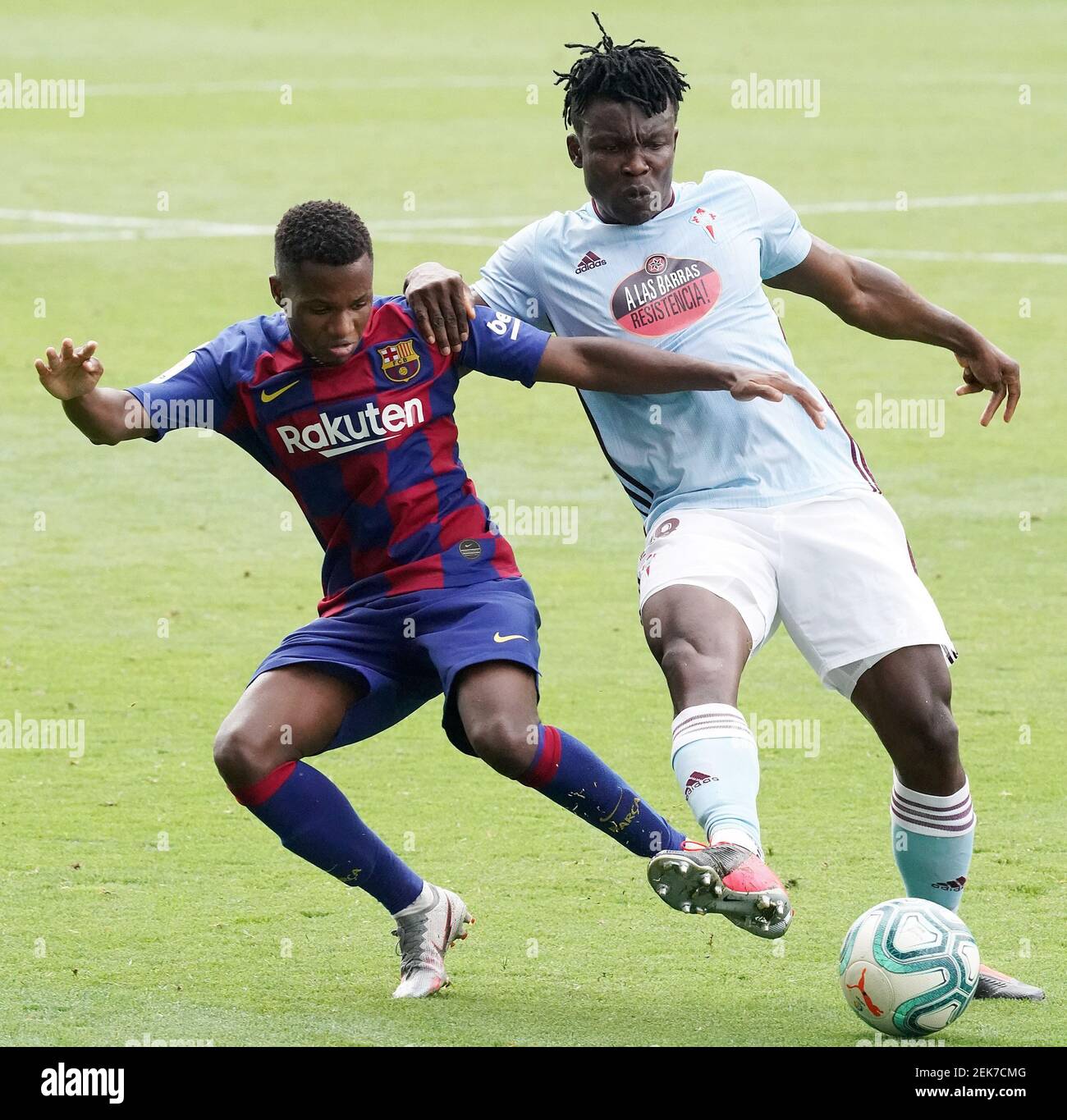 RC Celta de Vigo's Joseph Aidoo (r) and FC Barcelona's Ansu Fati during ...