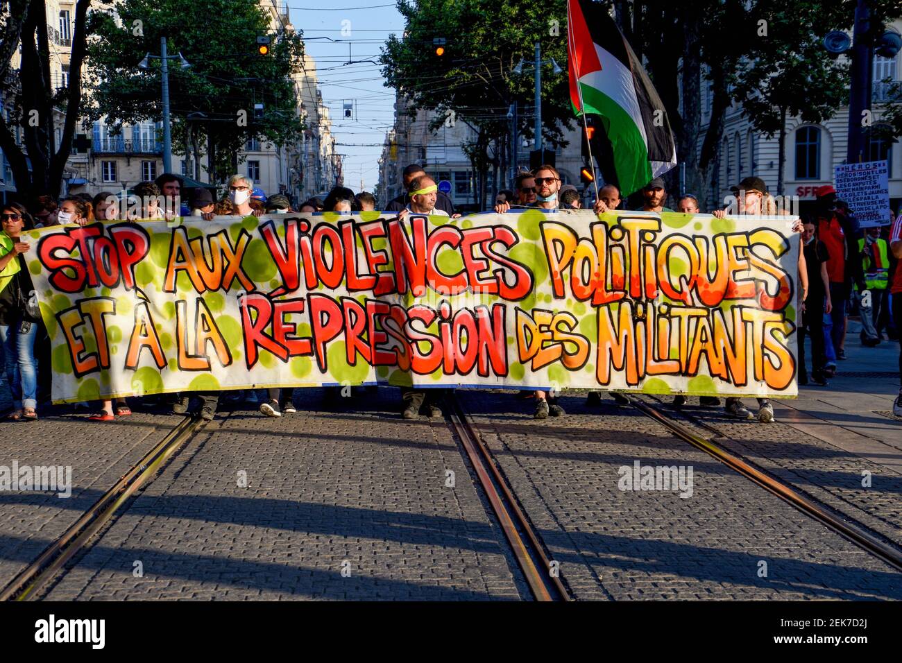 Protesters hold a banner during a demonstration. Several demonstrators ...