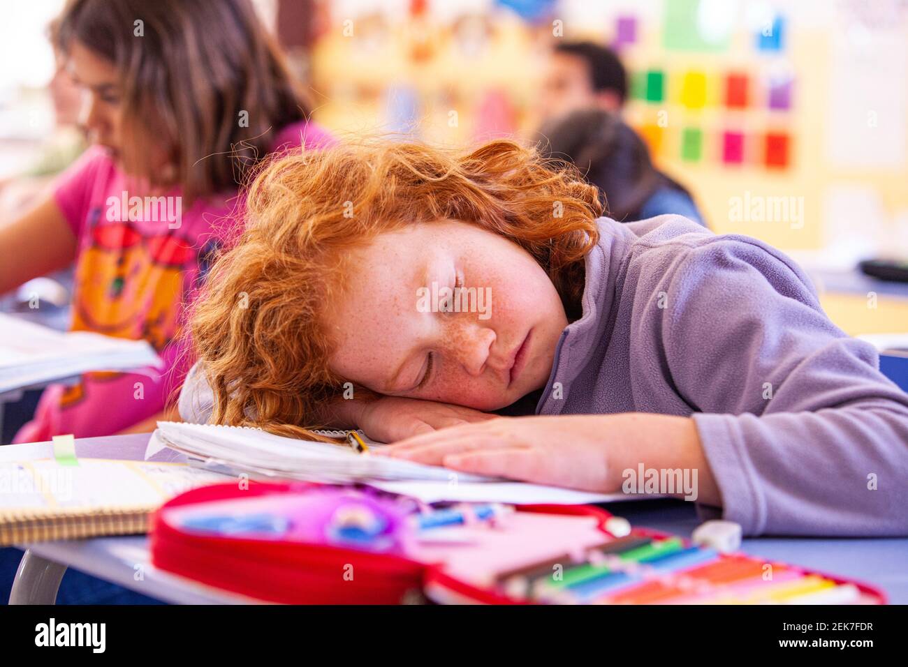 Exhausted children sleeping in an elementary school classroom Stock ...