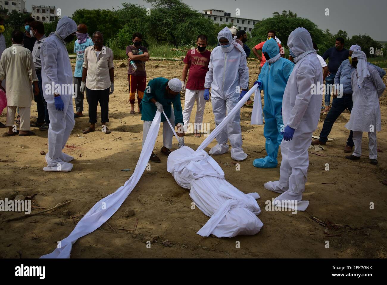 (EDITORS NOTE: Image depicts death) Undertakers wearing protective ...