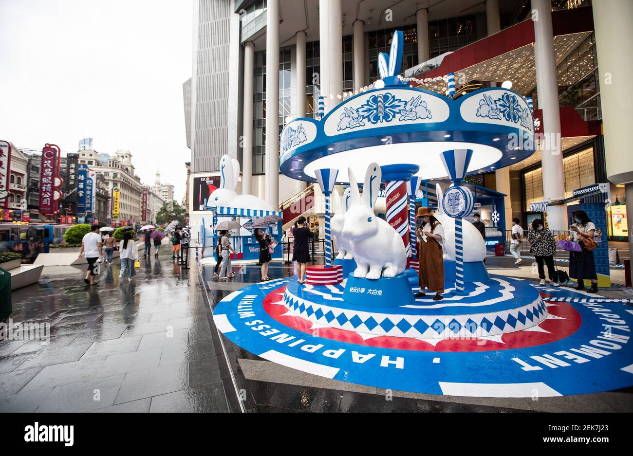 People line up to get a blind box in front of the White Rabbit blind ...