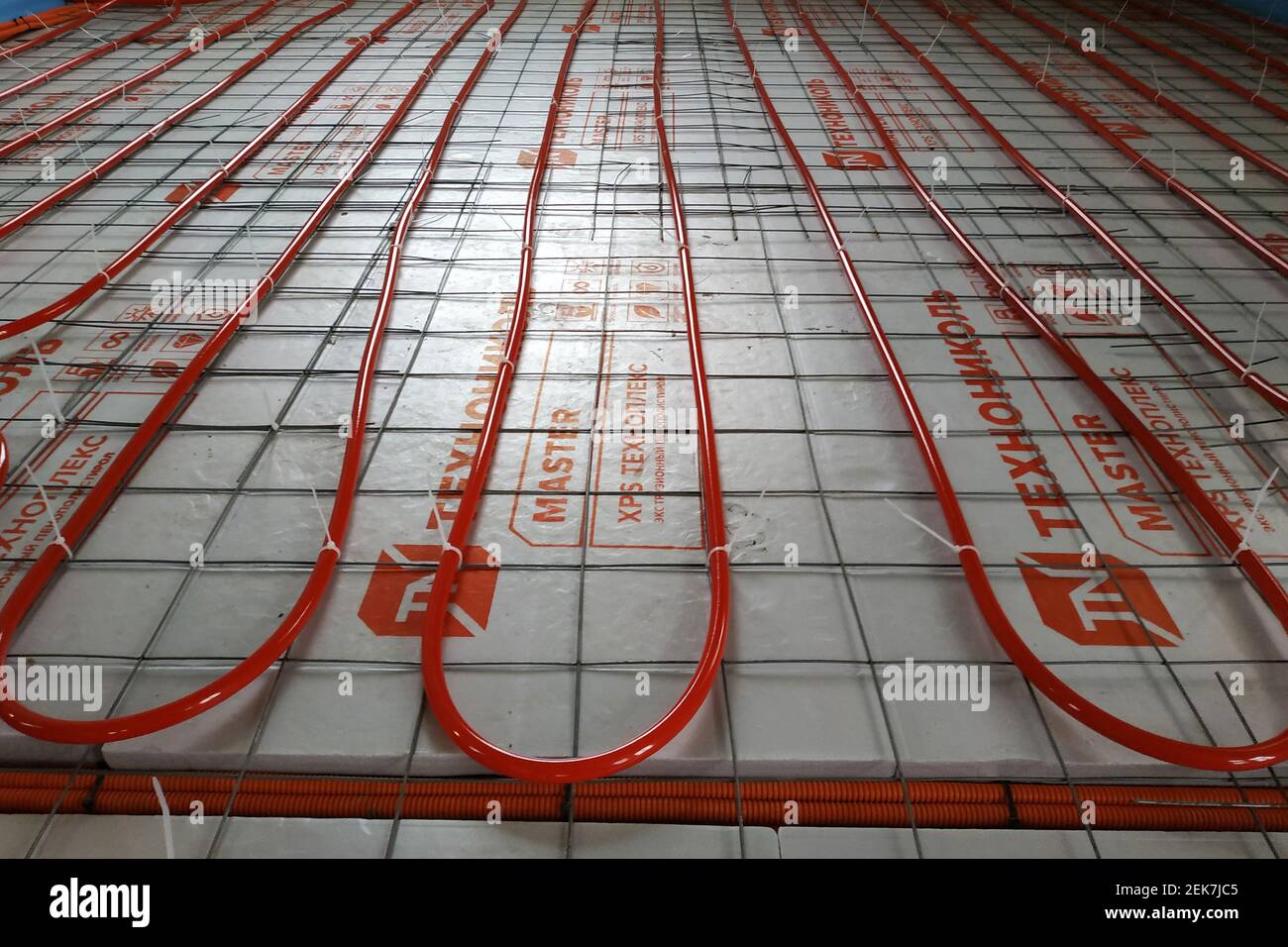 Installation of underfloor heating system, closeup on the water floor ...