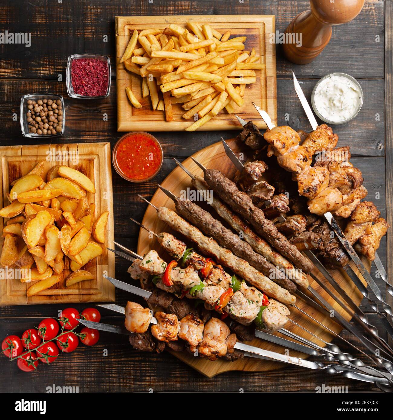 made dish of skewers, grilled chicken, beef, pork meat with bbq and ...