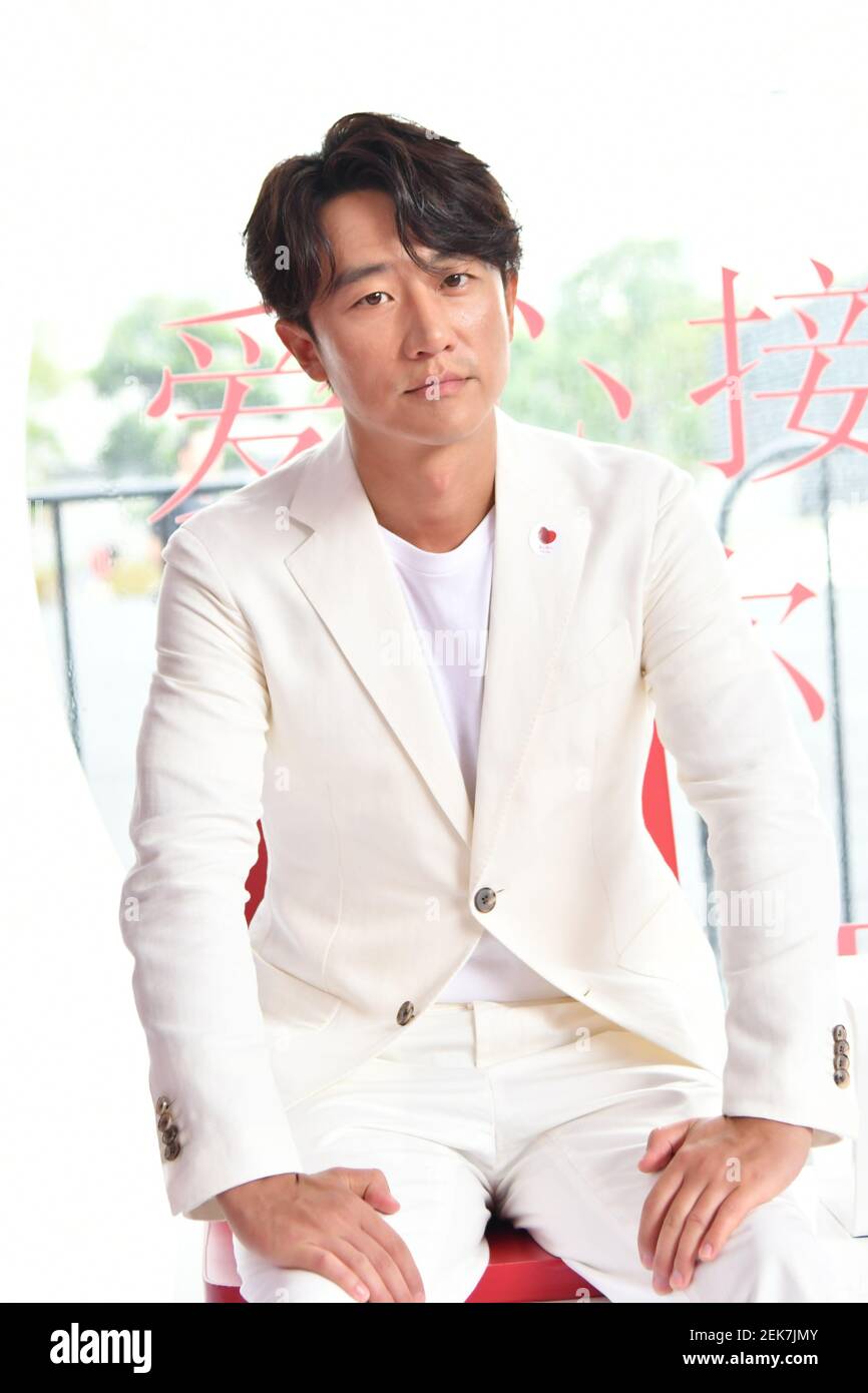 Chinese actor Huang Xuan attends a charity activity of a cosmetic brand ...