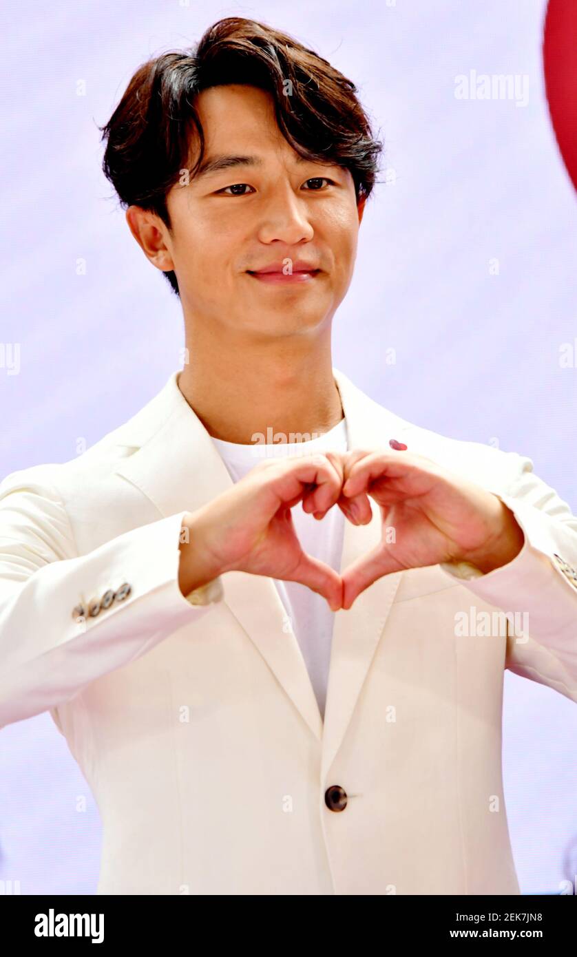 Chinese actor Huang Xuan attends a charity activity of a cosmetic brand ...