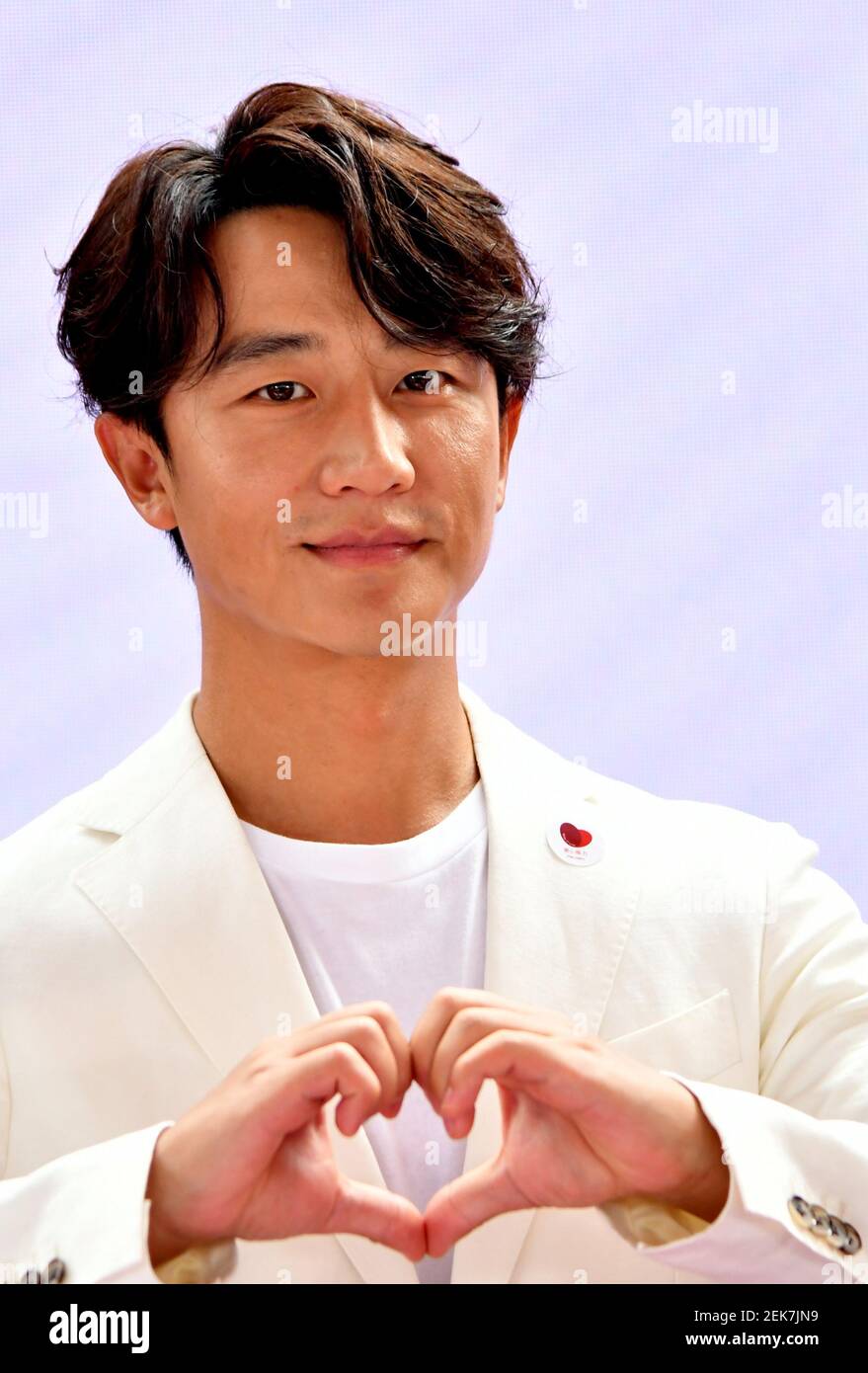 Chinese actor Huang Xuan attends a charity activity of a cosmetic brand ...