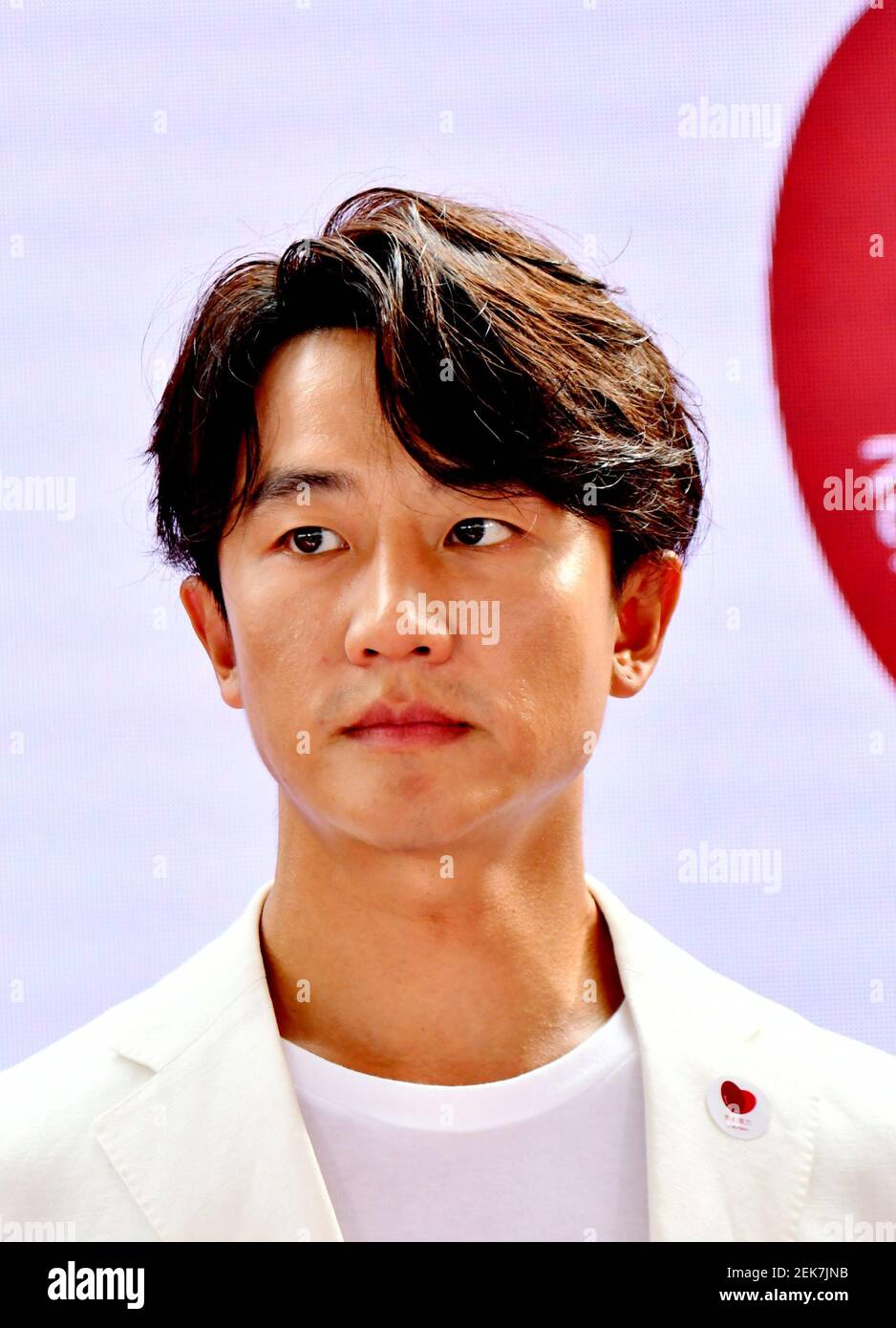 Chinese actor Huang Xuan attends a charity activity of a cosmetic brand ...