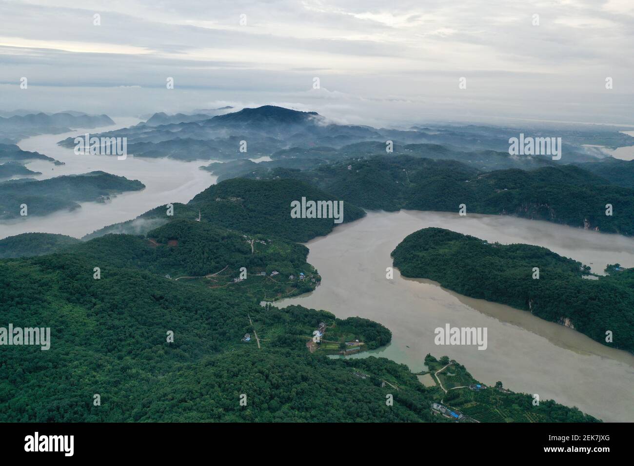 An aerial view of the confluence of Yangtze River and its branch Qing River, both water levels ...