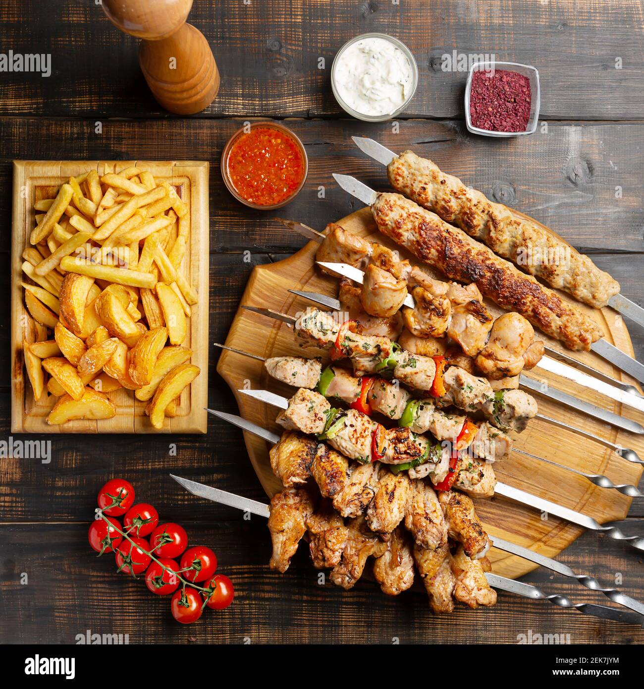 made dish of skewers, grilled chicken, beef, pork meat with bbq and ...