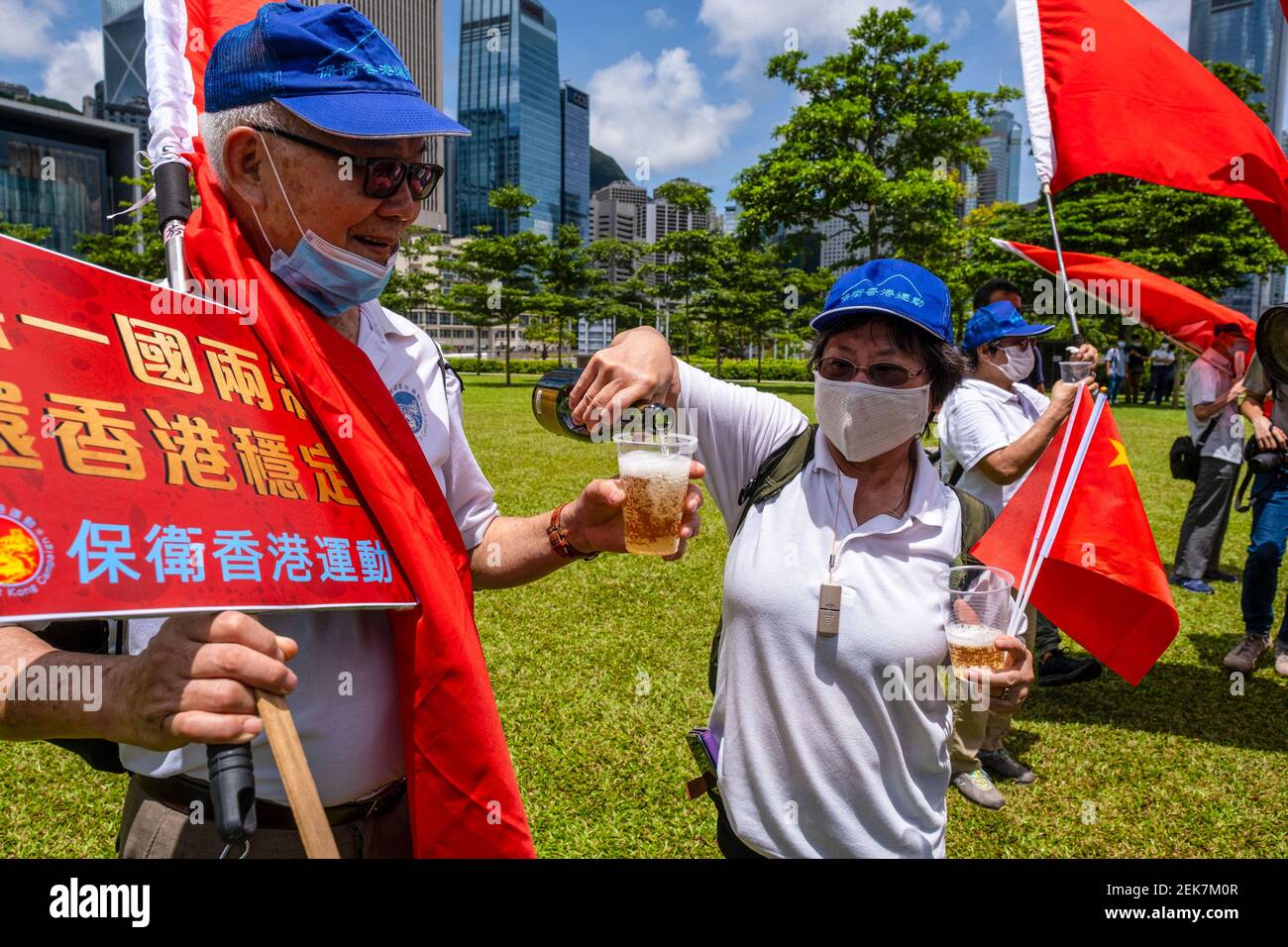 Pro-China supporter holds a pro Chinese and Hong Kong placard while ...
