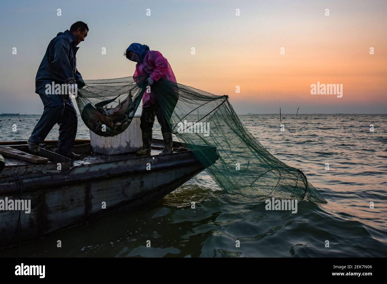 SIQIAN, CHINA - JULY 1, 2020 - Fishermen fish in Luoma Lake. Suqian ...