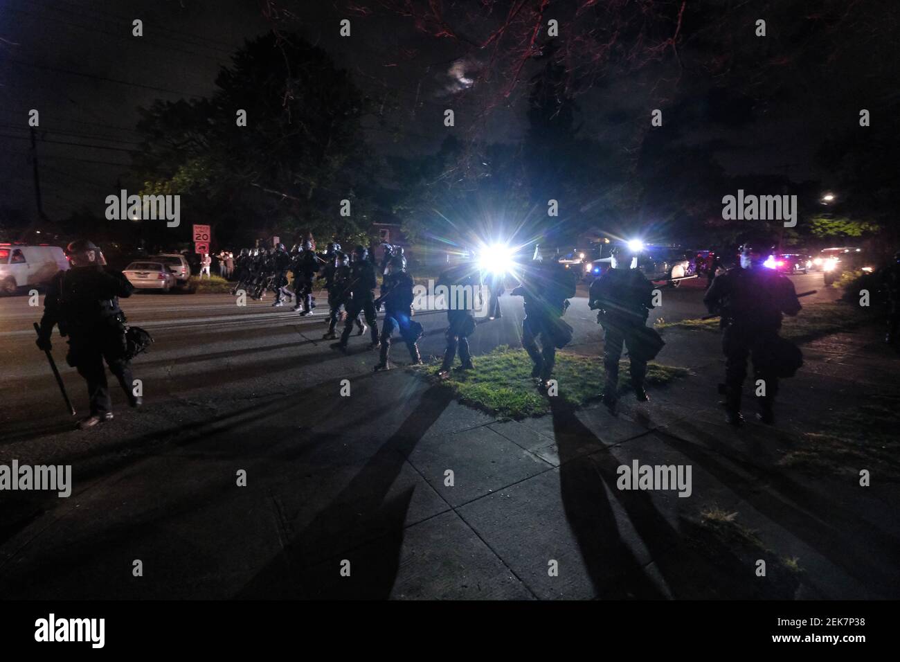Police clear the streets in North Portland, Ore., on June 30, 2020, as ...