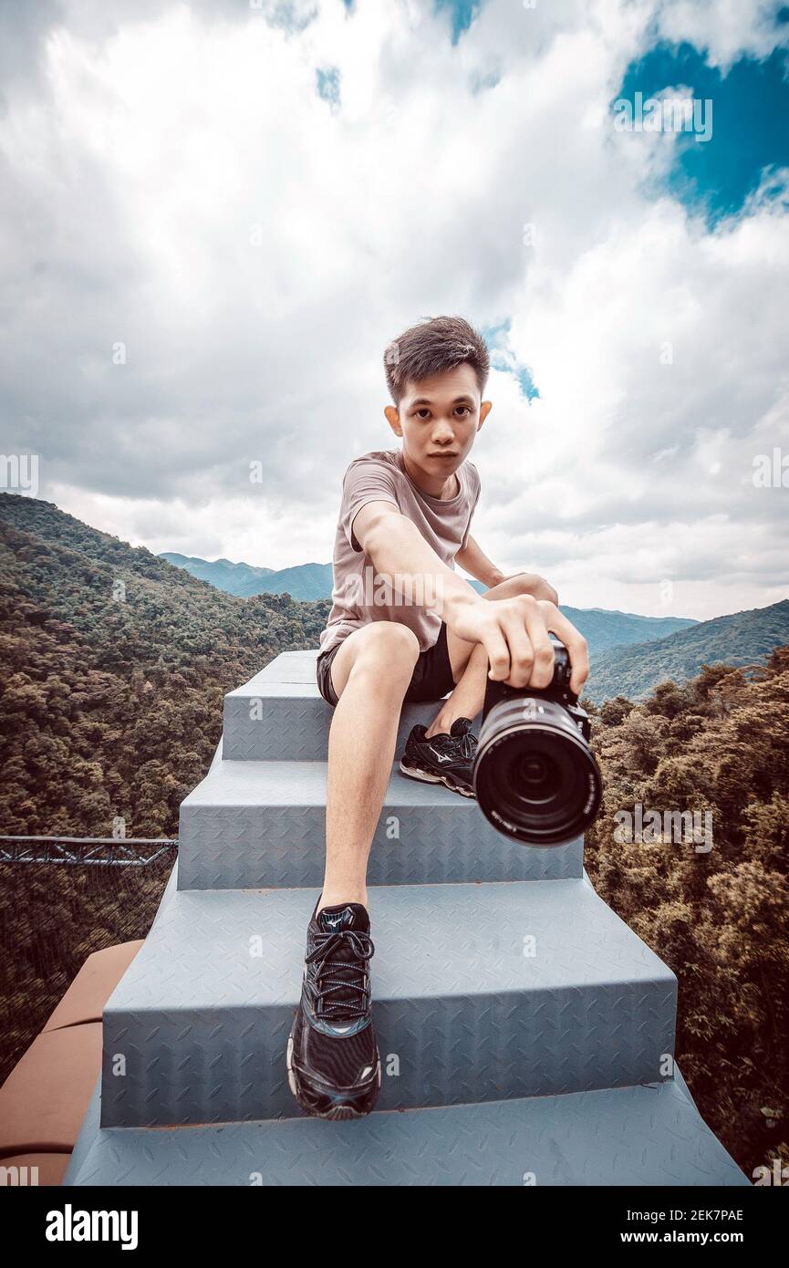 Tourists take pictures at the internet-famous site of Gulong Canyon ...