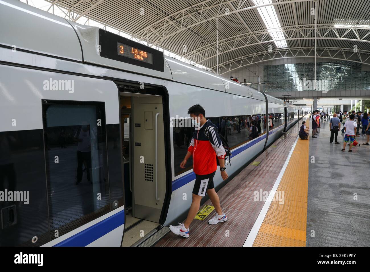 The train crew and travellers celebrate the opening of Shanghai-Suzhou ...