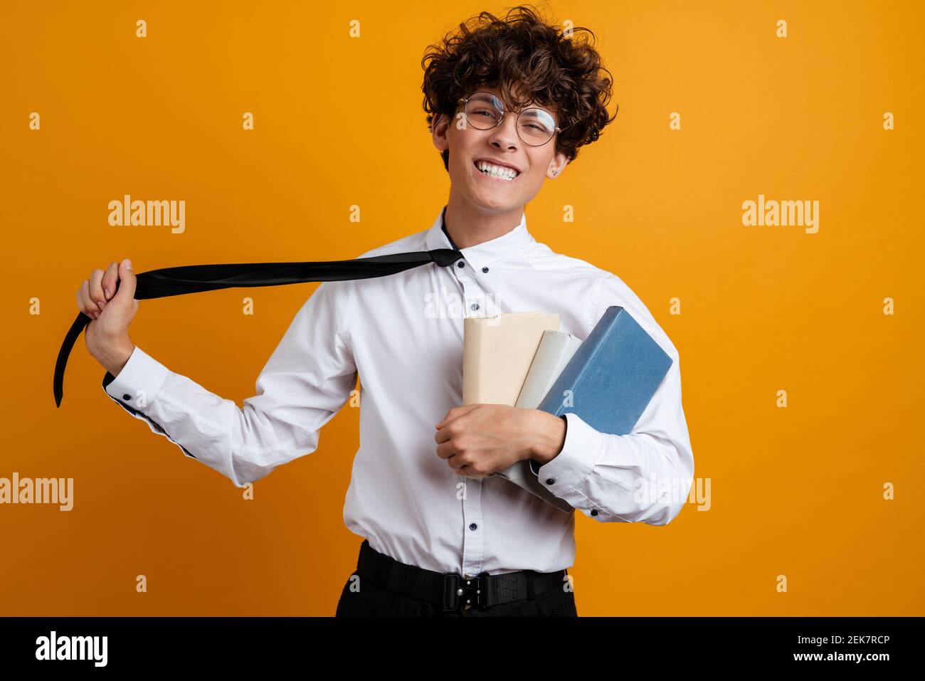 Sad frustrated college student guy holding books feeling lazy isolated ...