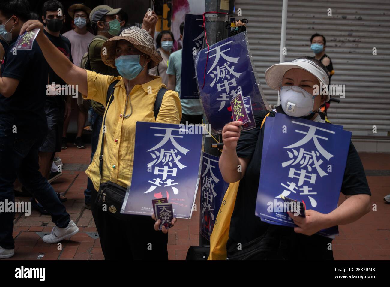 Protesters hold placards with anti-China message during the ...