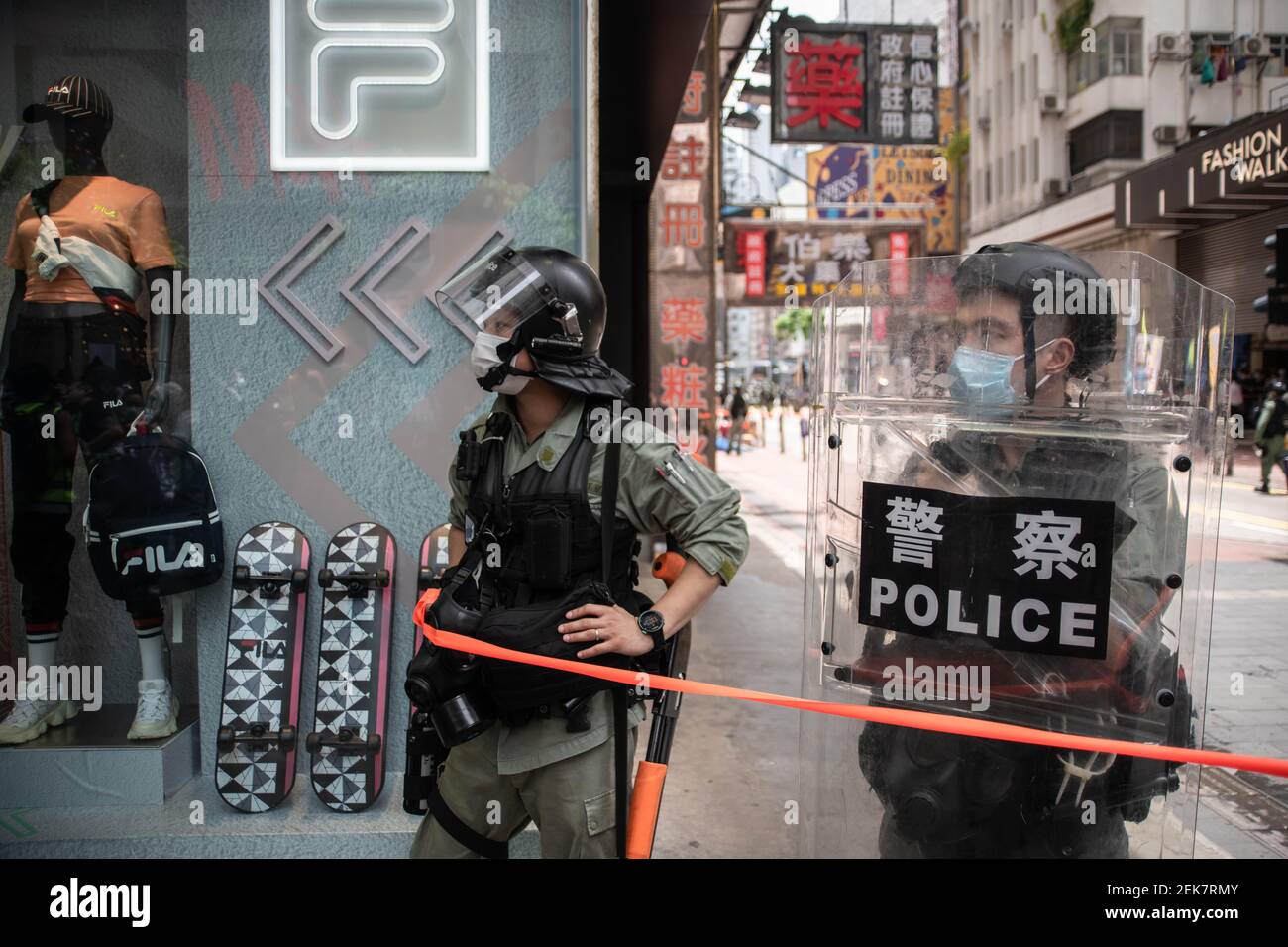 A group of riot police block a street during the demonstration ...