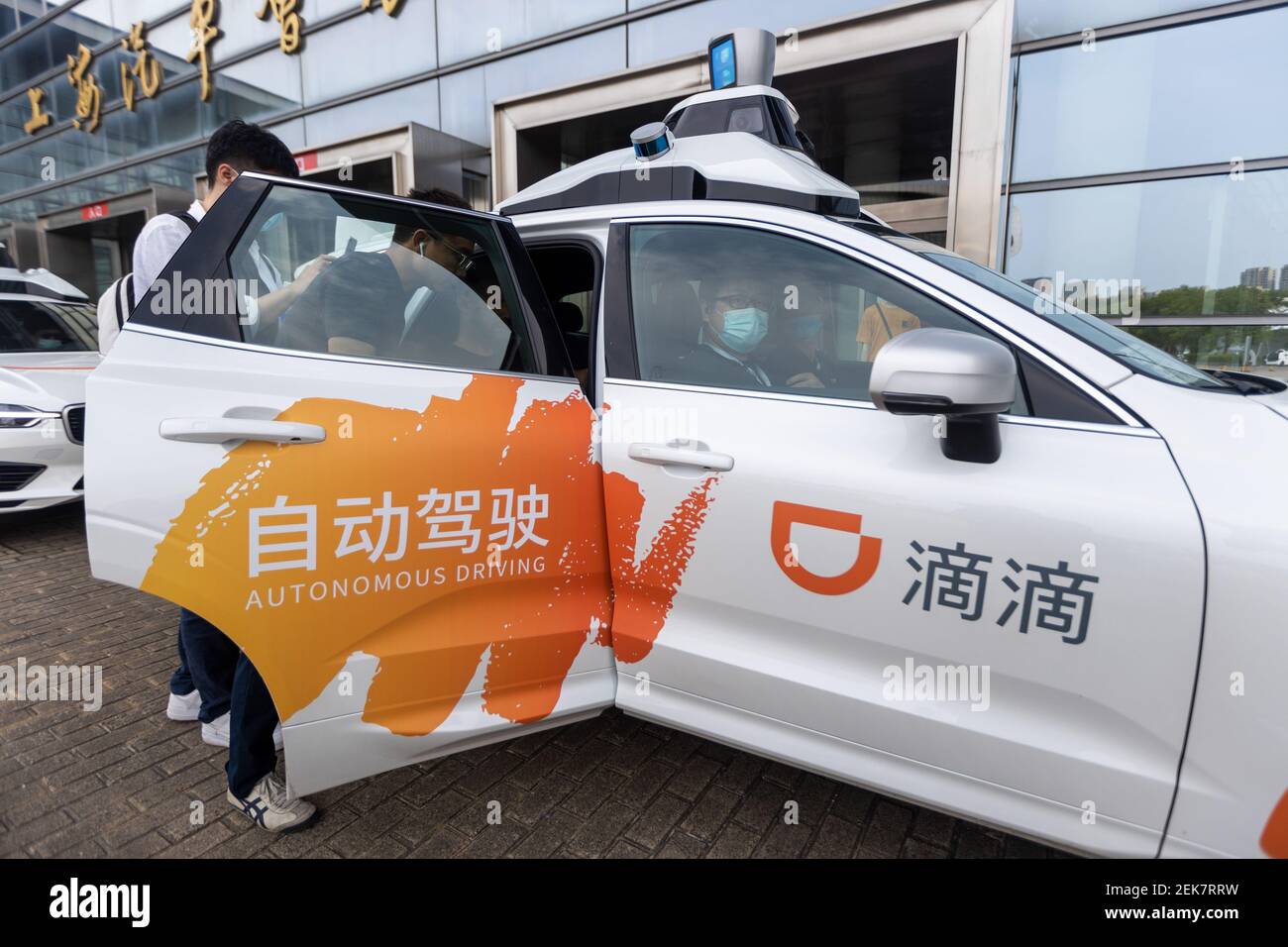 A person tries the DiDi unmanned driving in Shanghai, China, 27 June ...