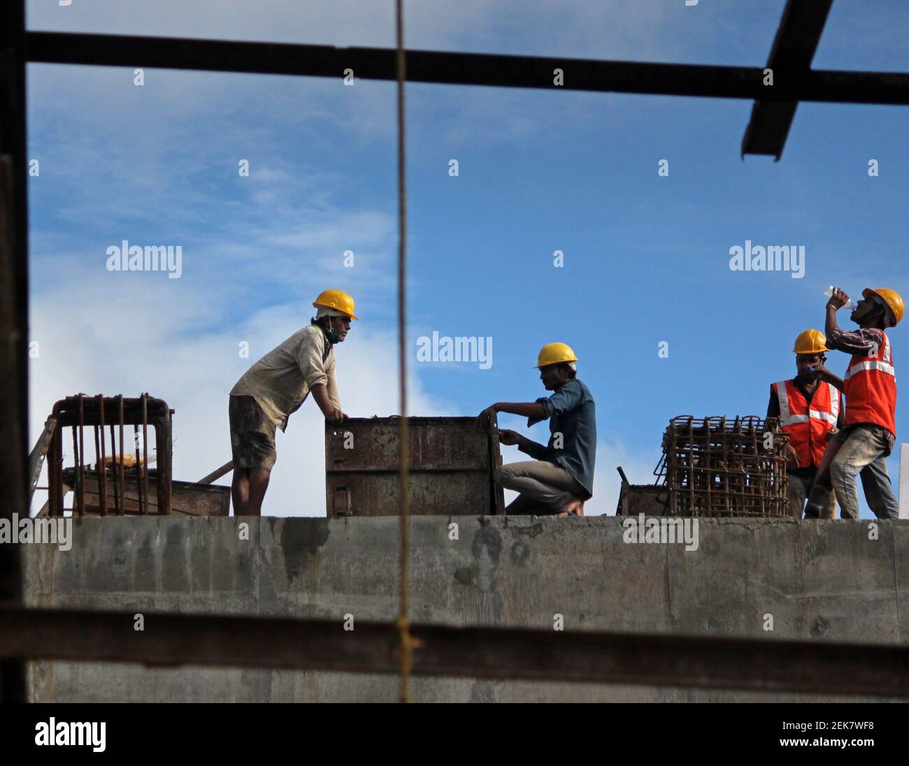 Labourers are seen working at a construction site. After the Union ...