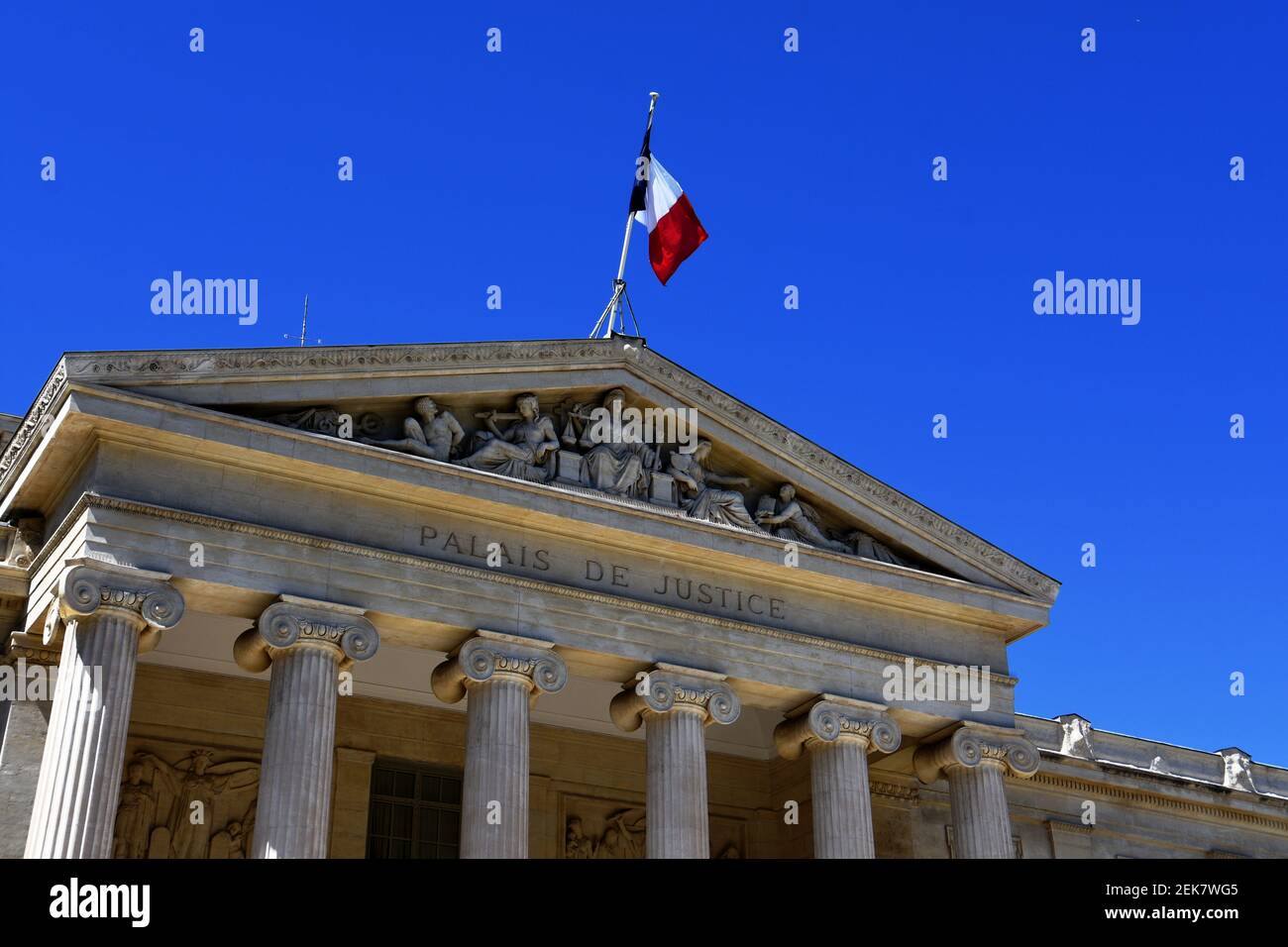 Facade of the courthouse with the French flag. (Photo by Gerard Bottino ...