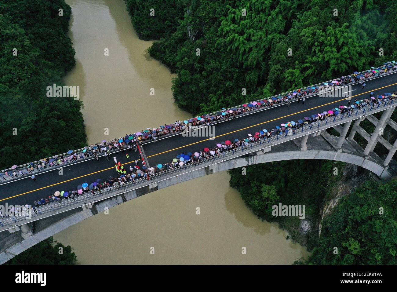 CHONGQING, CHINA - JULY 3, 2020 - Villagers step on the guanhe Bridge ...