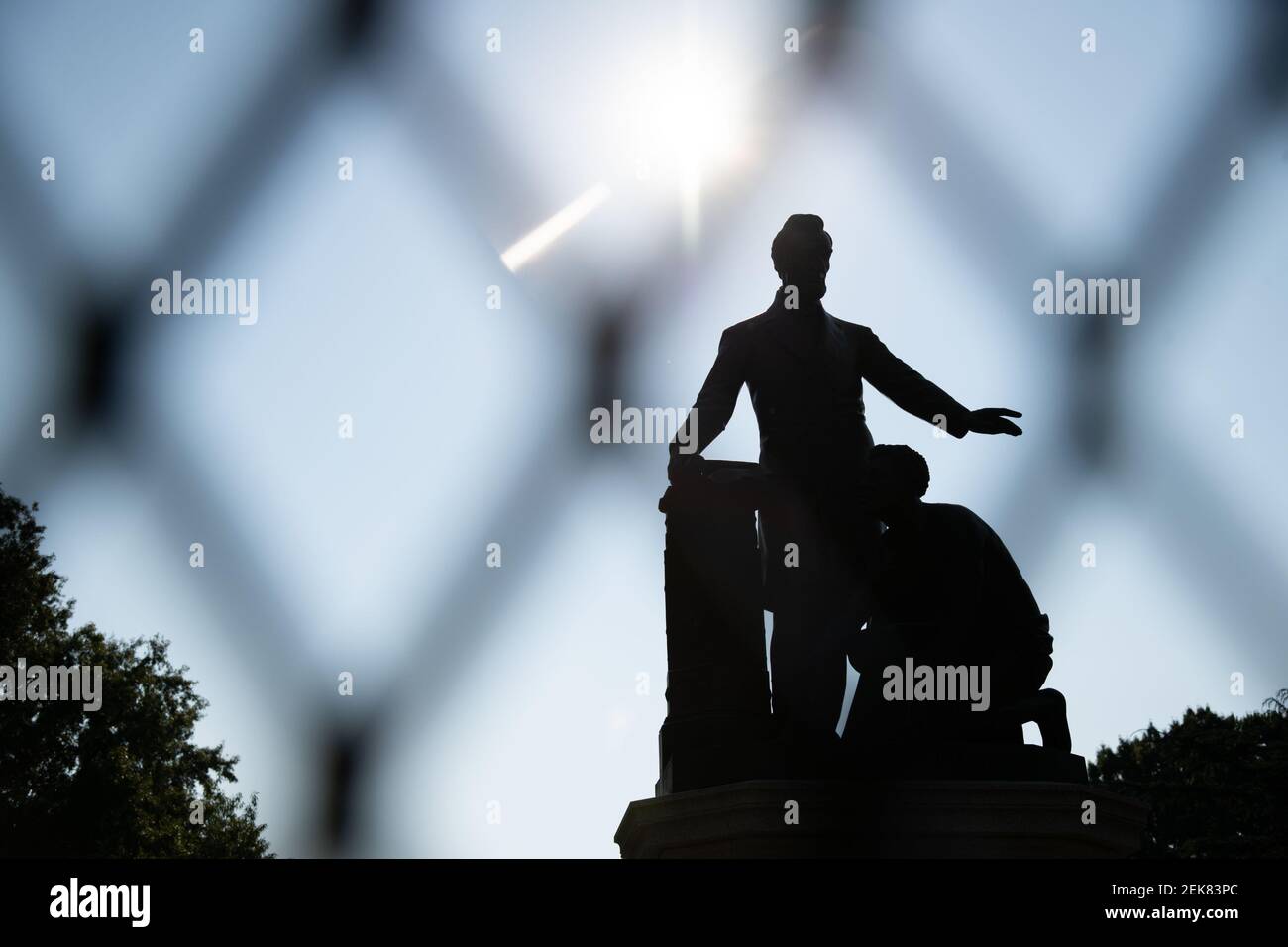 A silhouette view of the controversial Emancipation Memorial by Thomas ...