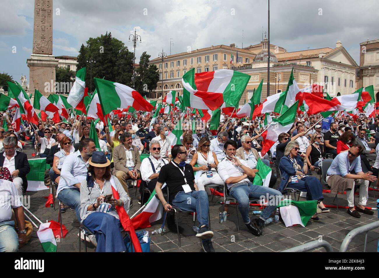 Italian center-right supporters with tricolor masks and flags during ...
