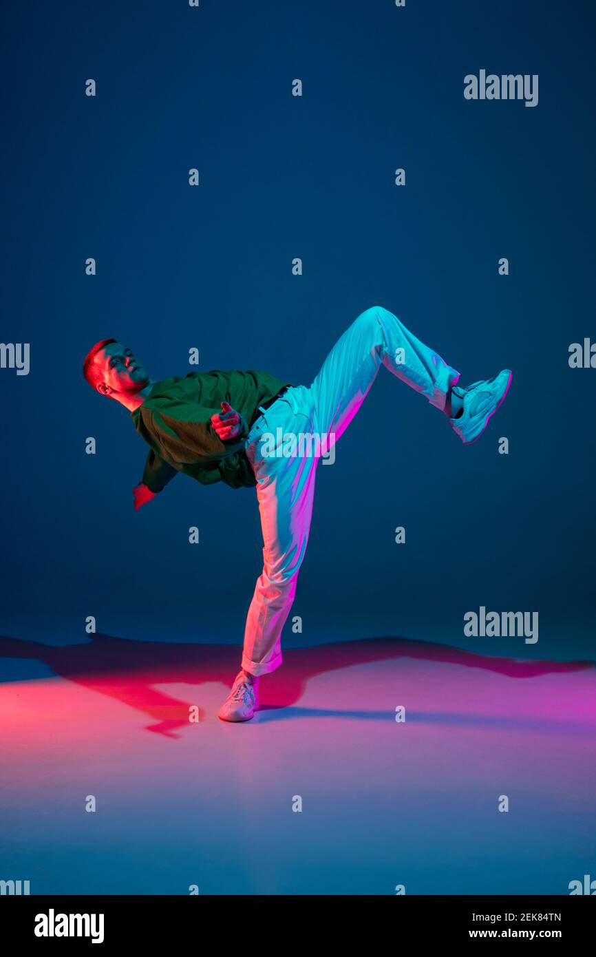Modern. Stylish sportive boy dancing hip-hop in stylish clothes on ...