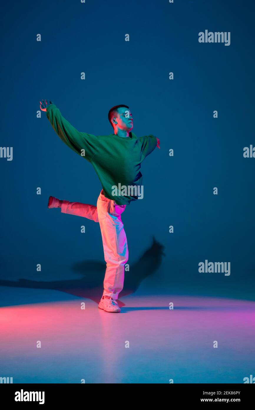 Fashion. Stylish sportive boy dancing hip-hop in stylish clothes on ...