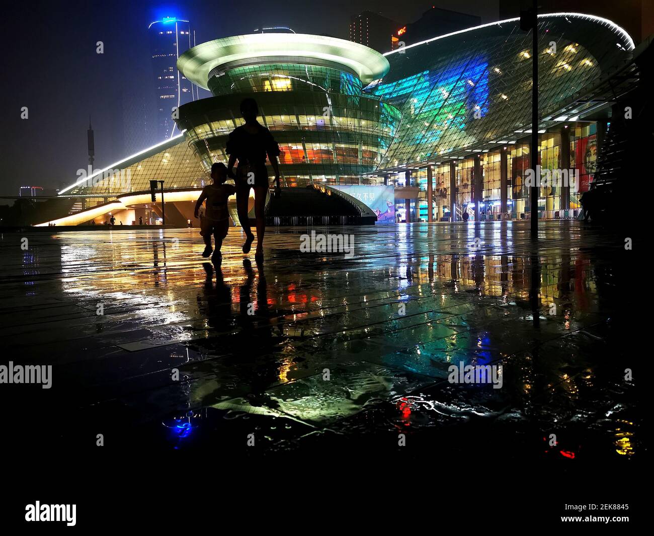 Buildings with LED lights on and their reflections on the Qiantang ...